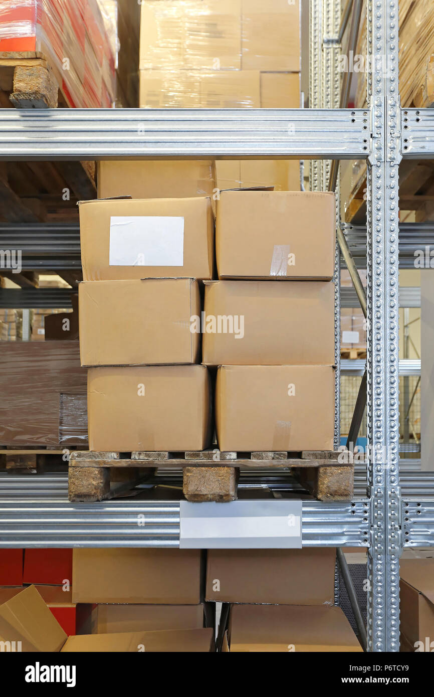 Shelves loaded with merchandise in distribution warehouse Stock Photo ...