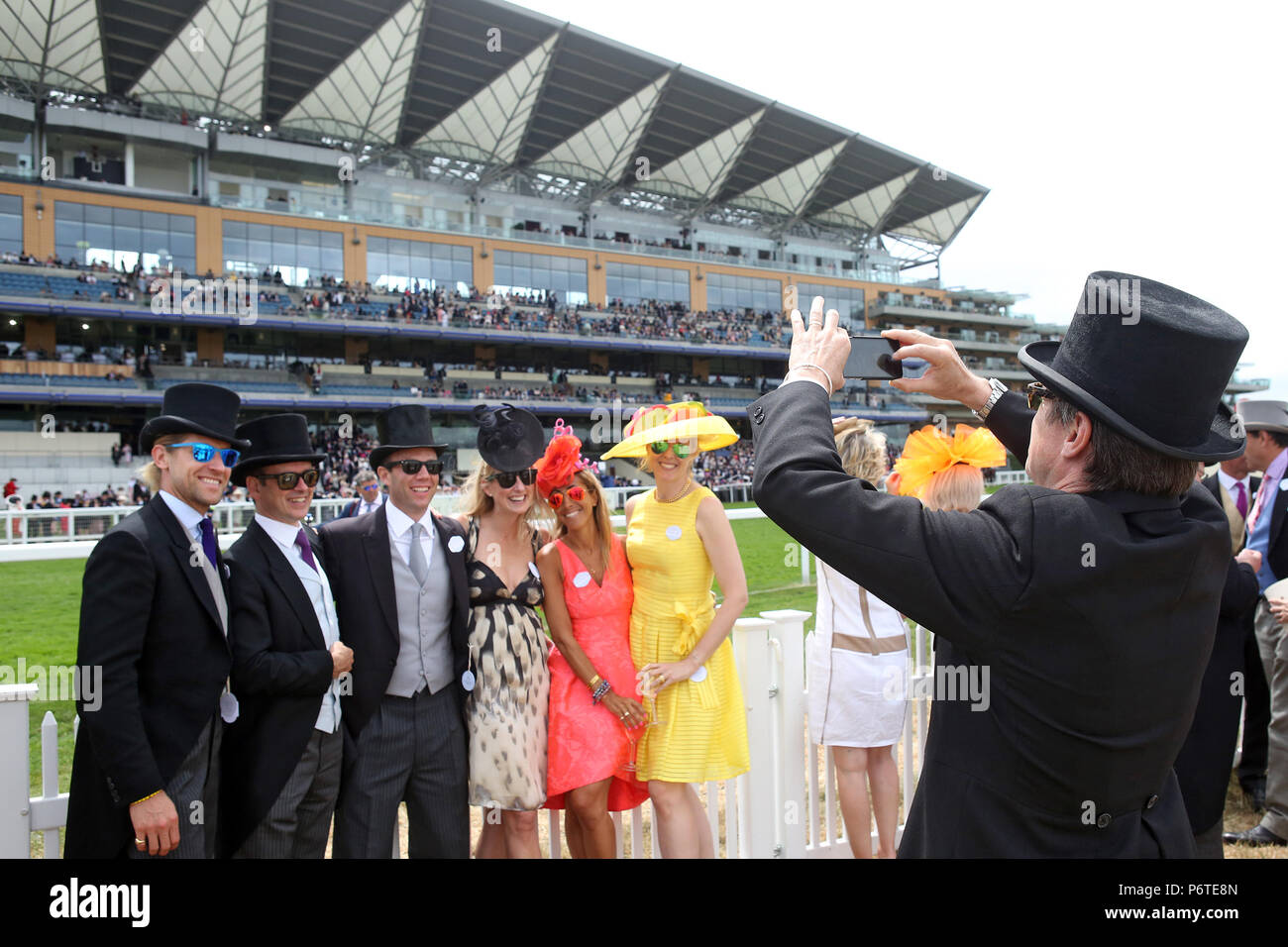 Royal Ascot, Man with top has taken a picture of his friends standing ...
