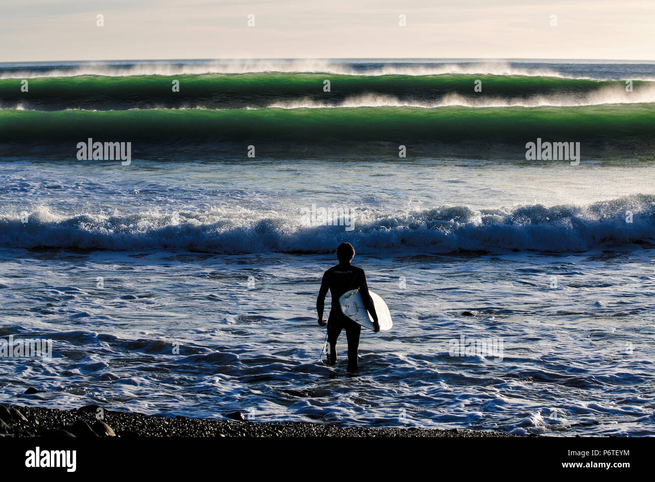 Surfer paddling out into the waves hi-res stock photography and images ...