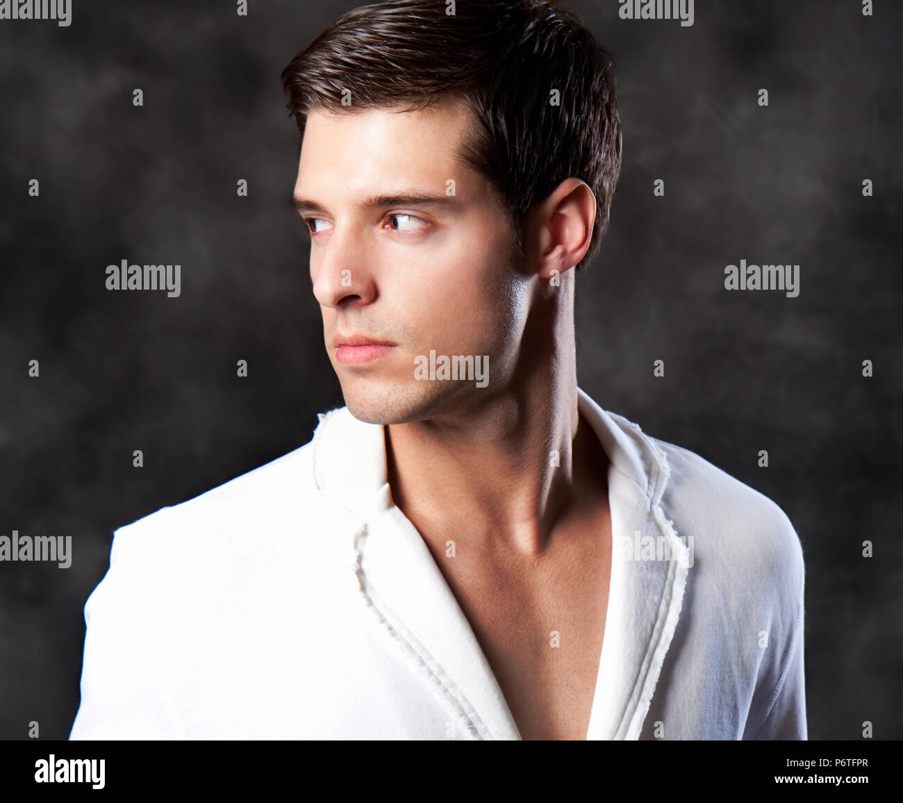 An attractive fashion man in a white environment Stock Photo - Alamy