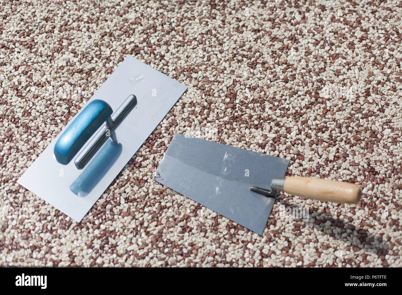 Coloured Concrete Around Pool with tools Stock Photo - Alamy