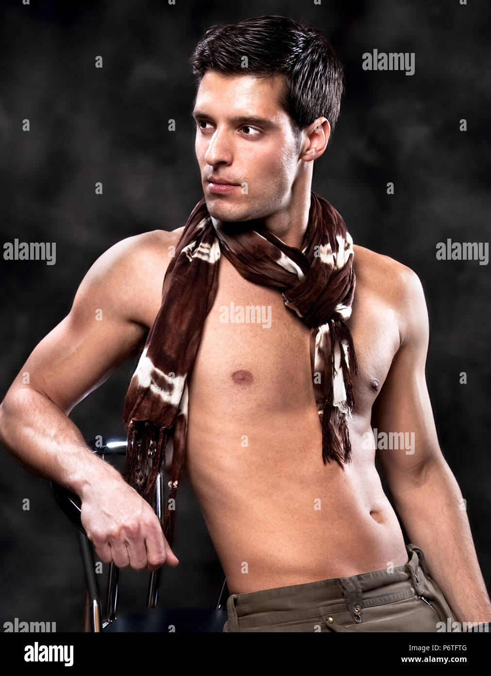 A portrait about a trendy attractive guy who has glamorous look ...