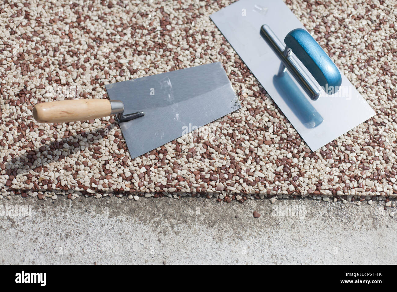 Coloured Concrete Around Pool with tools Stock Photo - Alamy