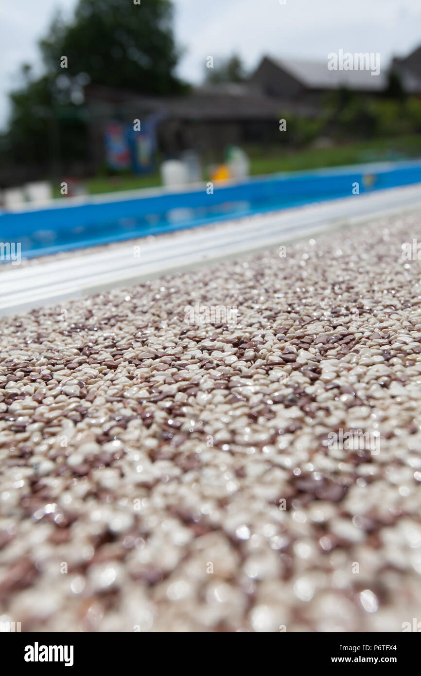 Texture of pebbles in an exposed aggregate foundation Stock Photo - Alamy