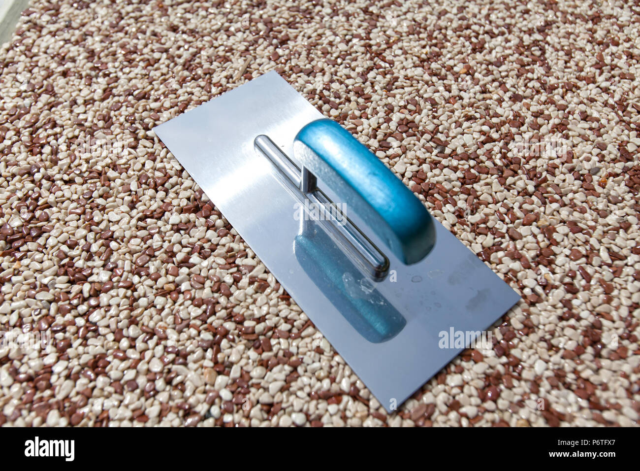 Coloured Concrete Around Pool with tools Stock Photo - Alamy