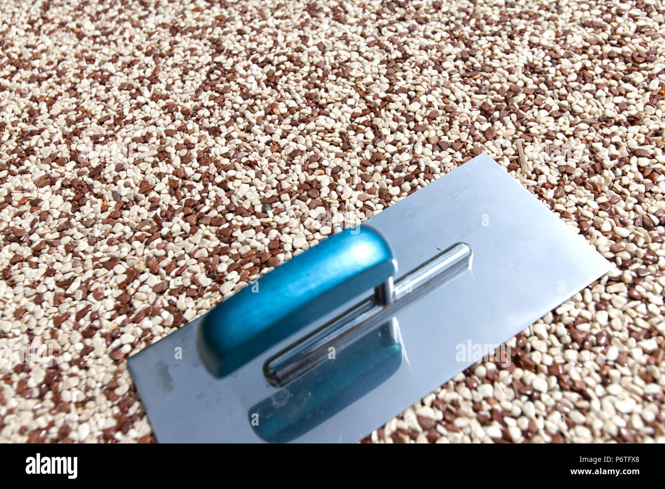 Coloured Concrete Around Pool with tools Stock Photo - Alamy