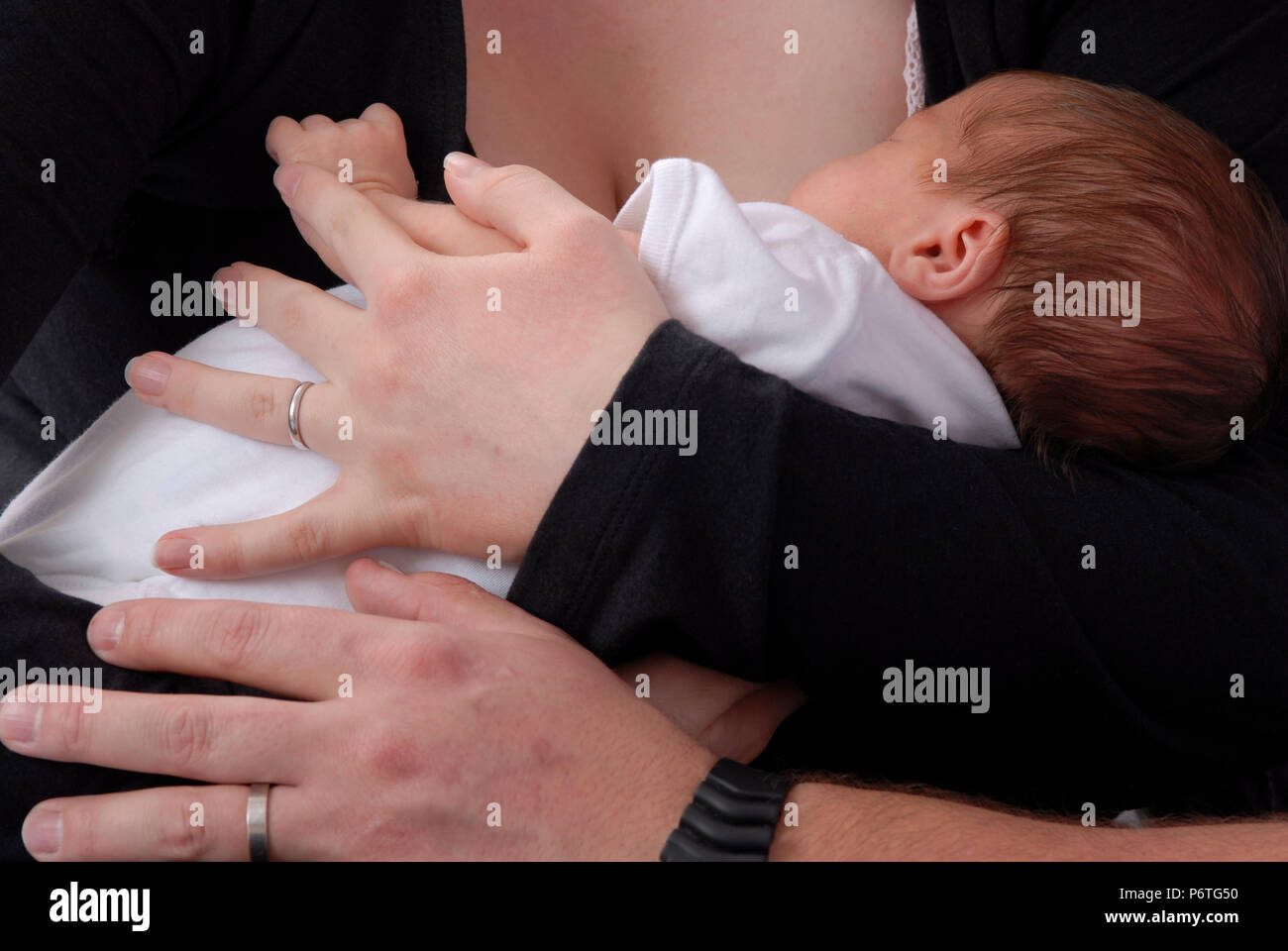 Mom cuddles newborn baby hi-res stock photography and images - Alamy