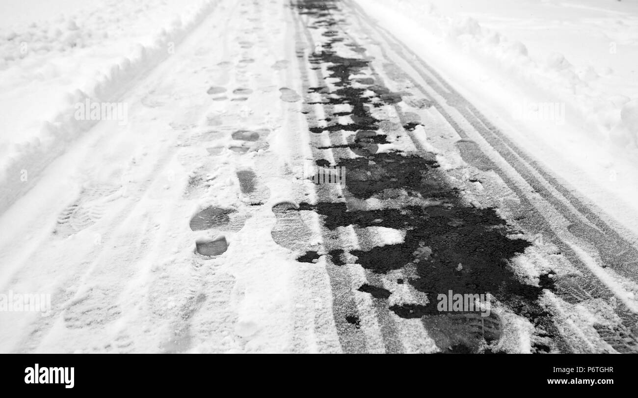 Footprints in the snow. Footprints on the first snow. Imprint of shoes ...