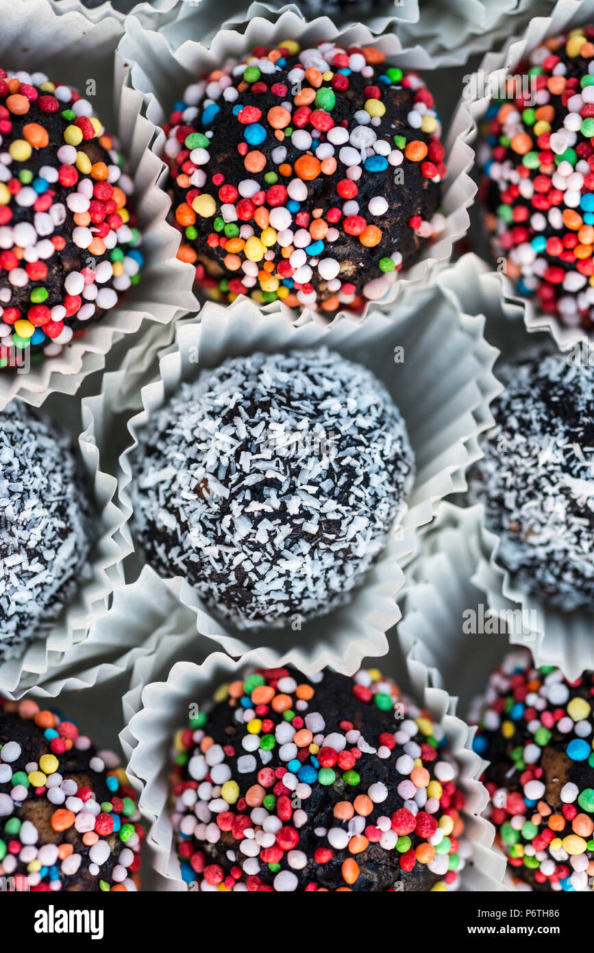 Chocolate ball with coconut and colorful topping Stock Photo - Alamy