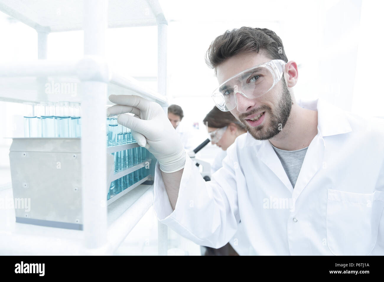 Serious young scientist doing hi-res stock photography and images - Alamy