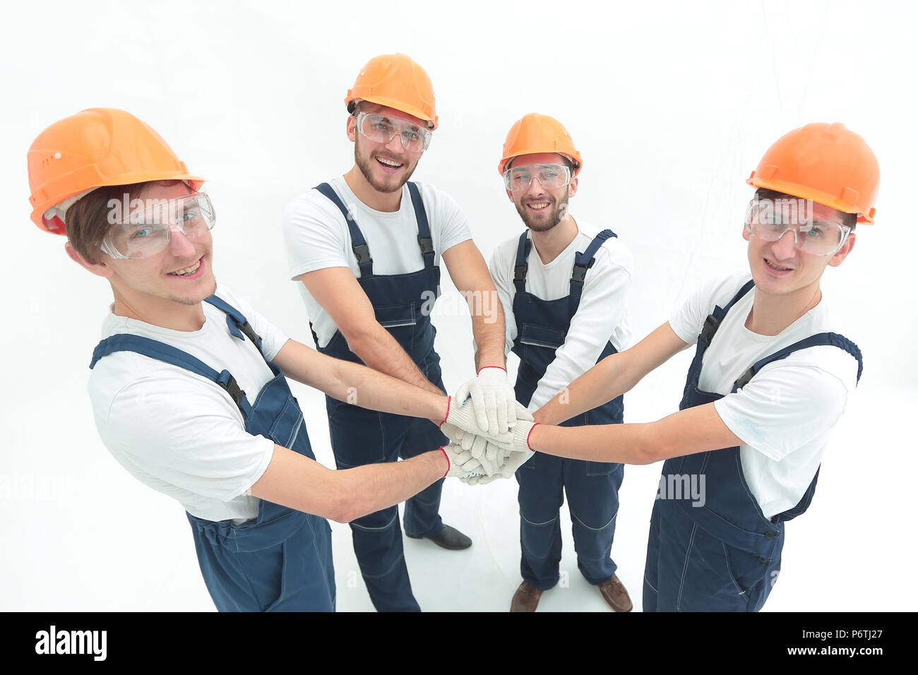 team of builders showing their solidarity Stock Photo - Alamy