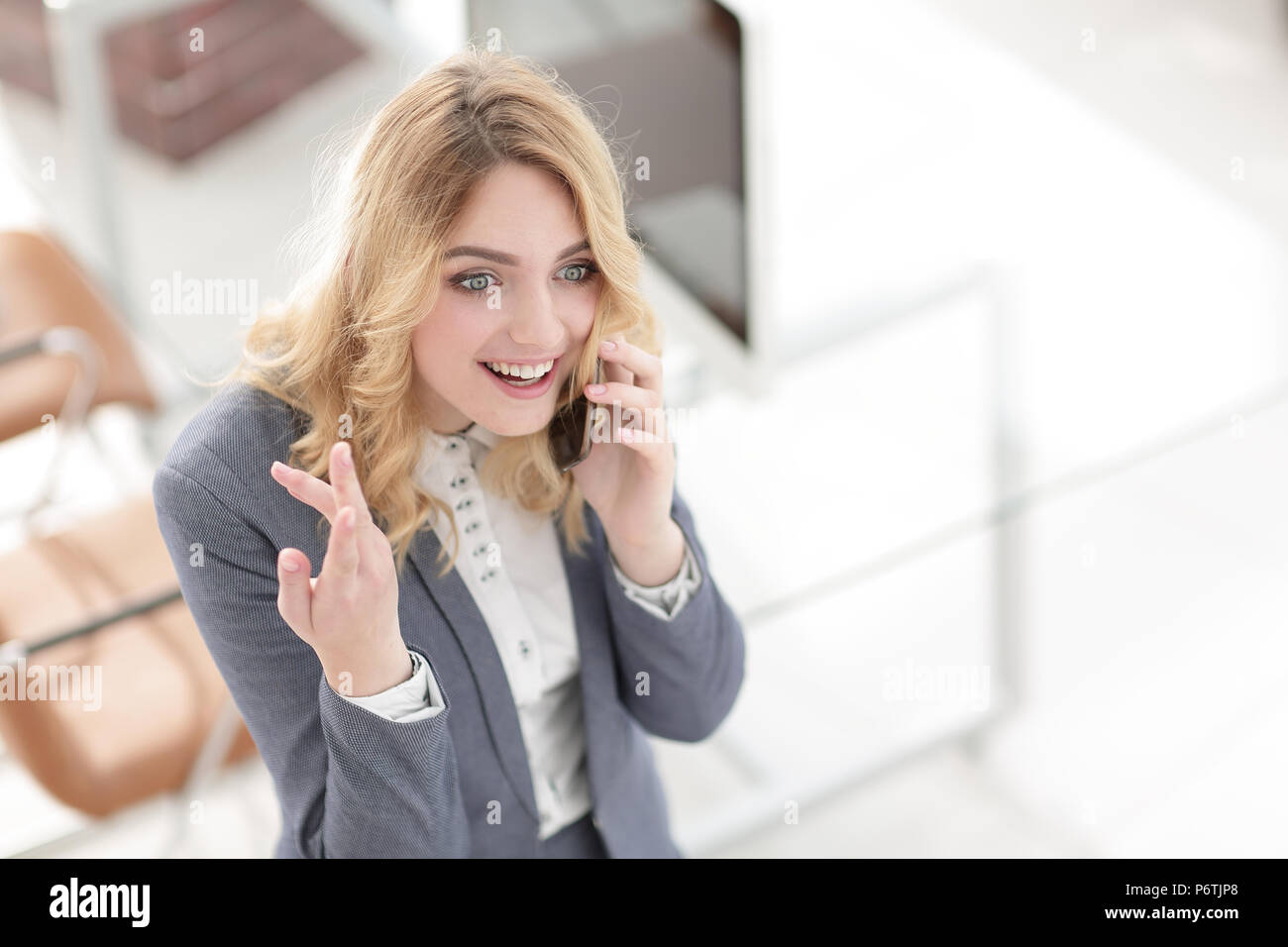 happy employee is talking on the smartphone Stock Photo - Alamy