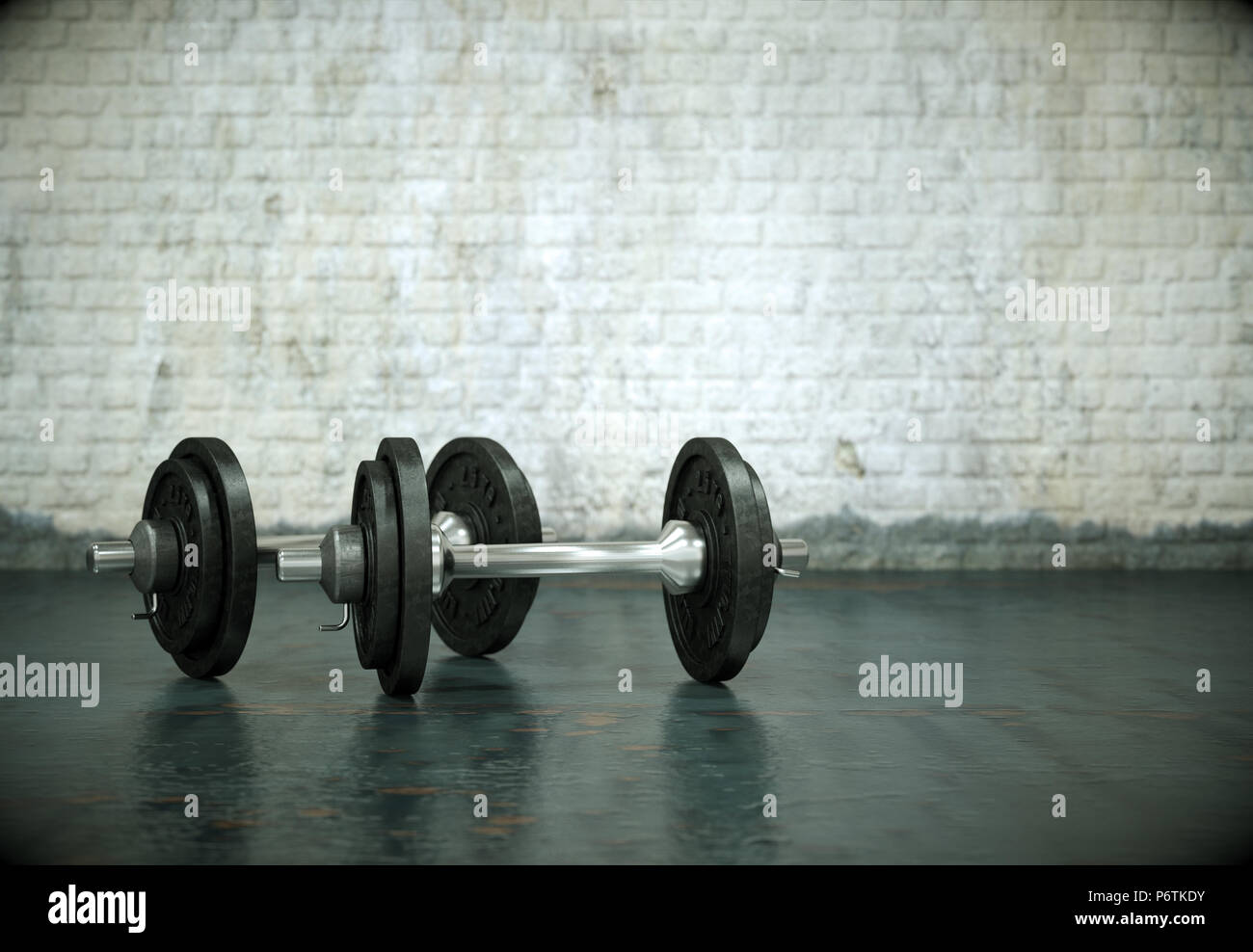 Dumbbell with black plates on a gym floor Stock Photo - Alamy