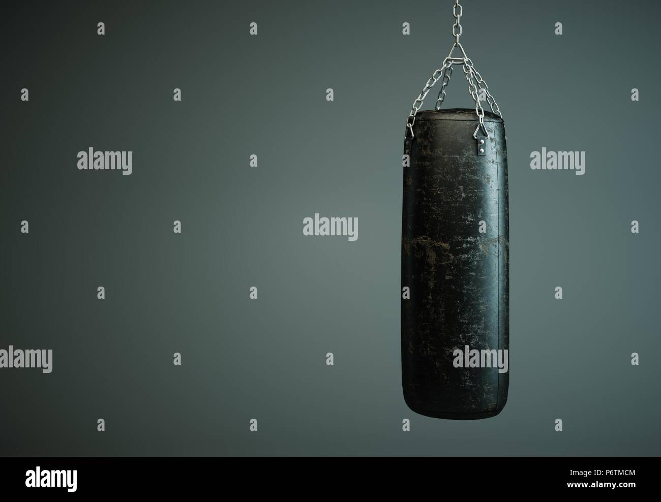 Black leather punching bag in empty room Stock Photo - Alamy
