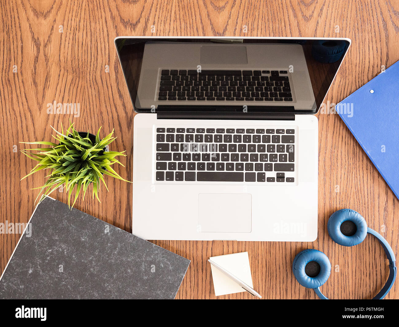 Business man's laptop viewd from above on wooden desk Stock Photo - Alamy