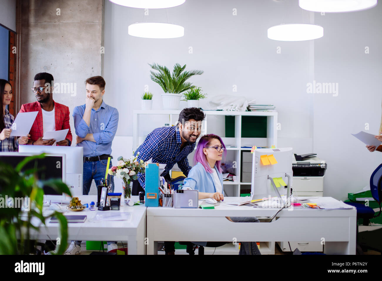 Indoor shot of loft modern business office interior with working stuff ...