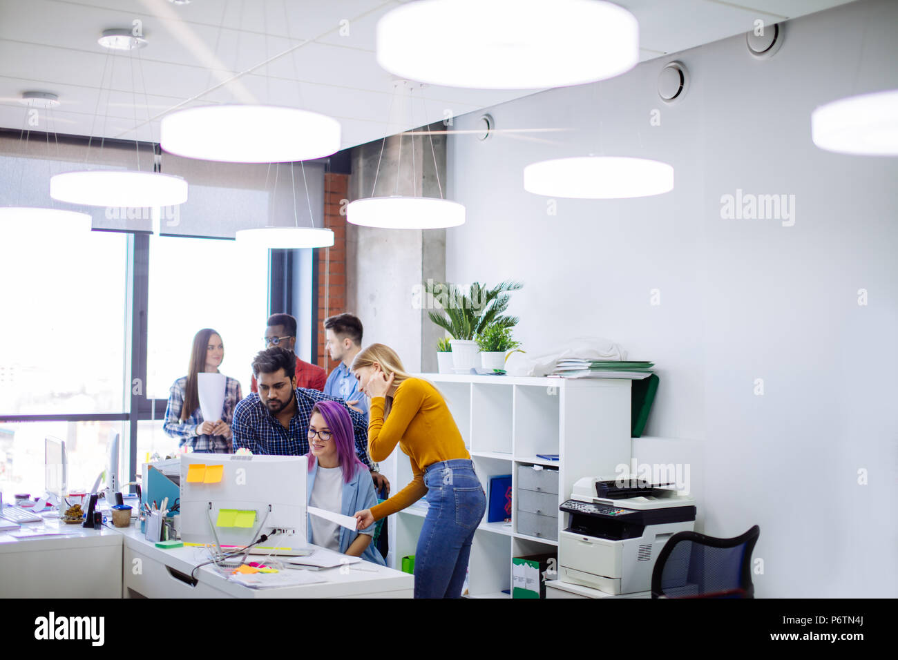 Indoor shot of loft modern business office interior with working stuff ...