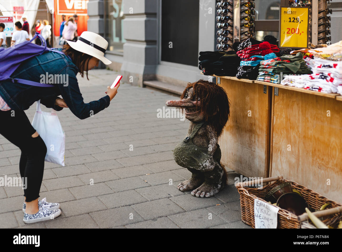 A asian tourist taking picture of sculpture in Oslo, Norway Stock Photo ...