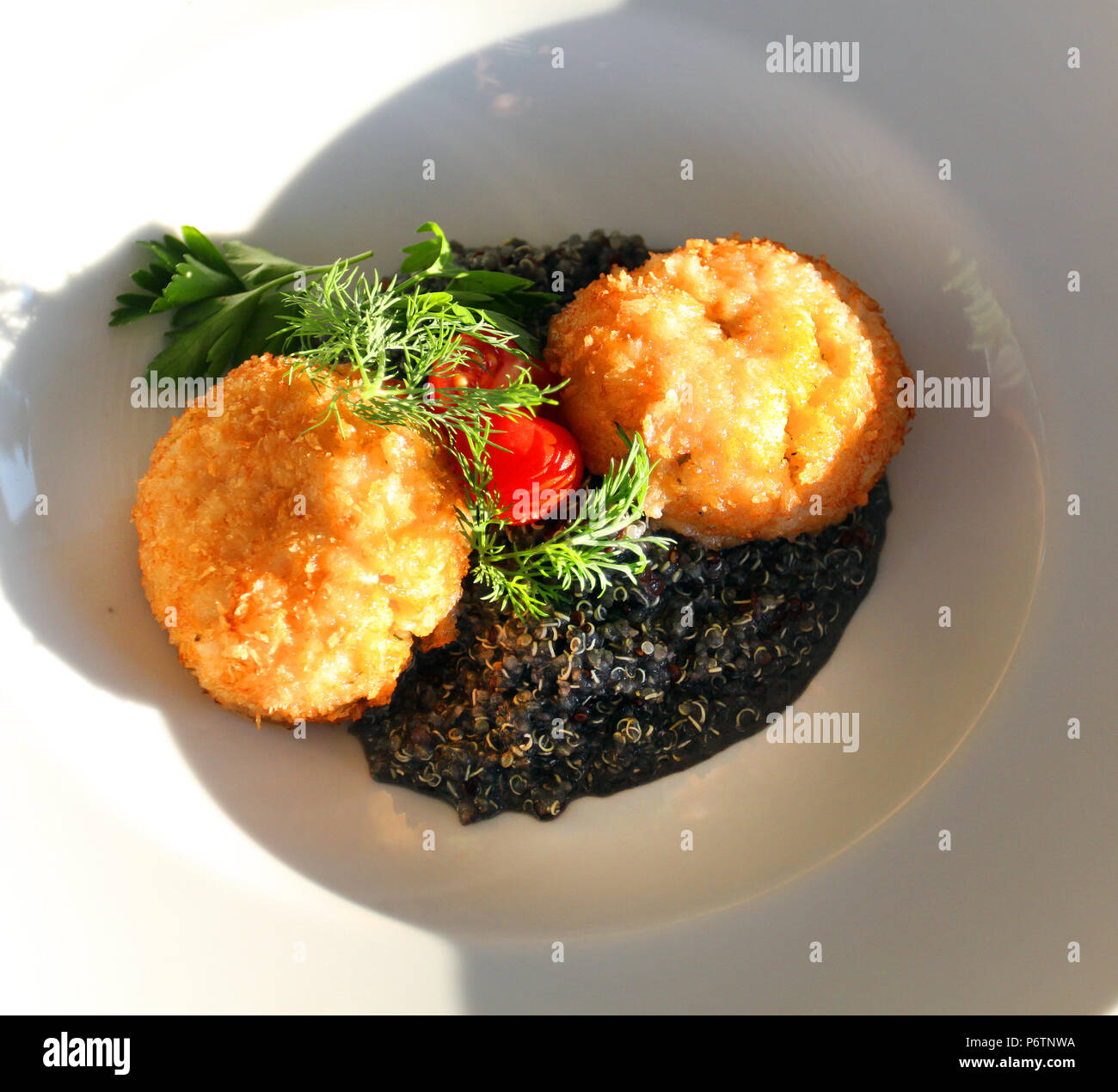 Photo of beautiful delicious fish cutlets and salad Stock Photo - Alamy