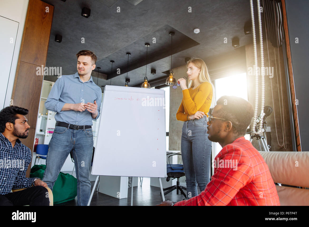 Group of multiracial friends thinking over route of their bike riding ...