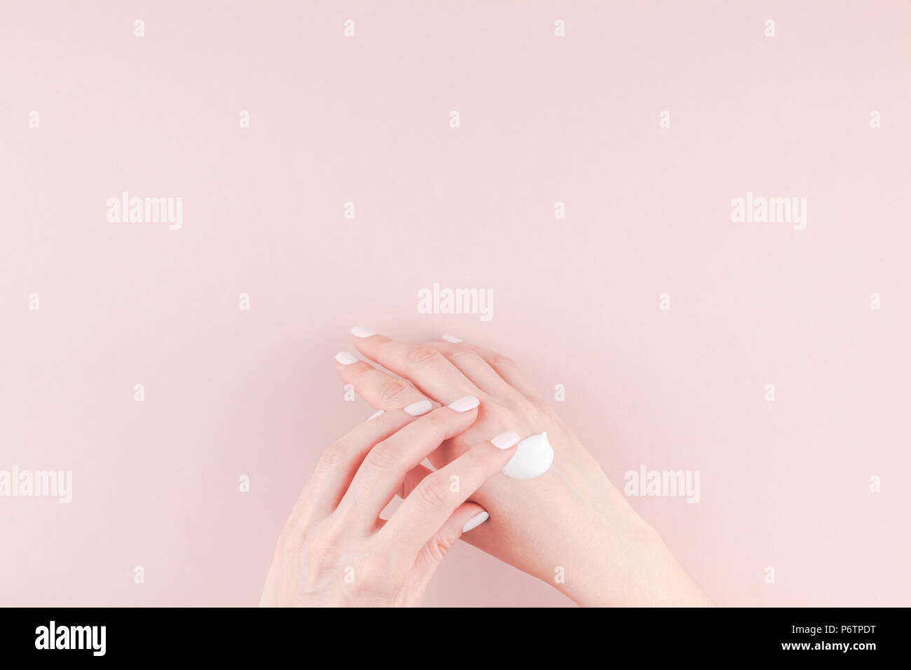 Creative image of woman moisturizing her hand with cosmetic cream ...