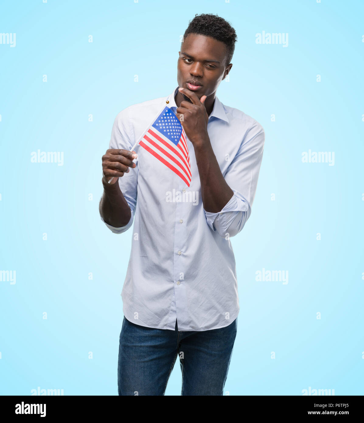 Confused black man holding usa hi-res stock photography and images - Alamy