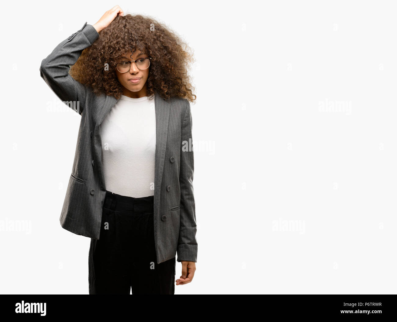 African american business woman wearing glasses confuse and wonder ...