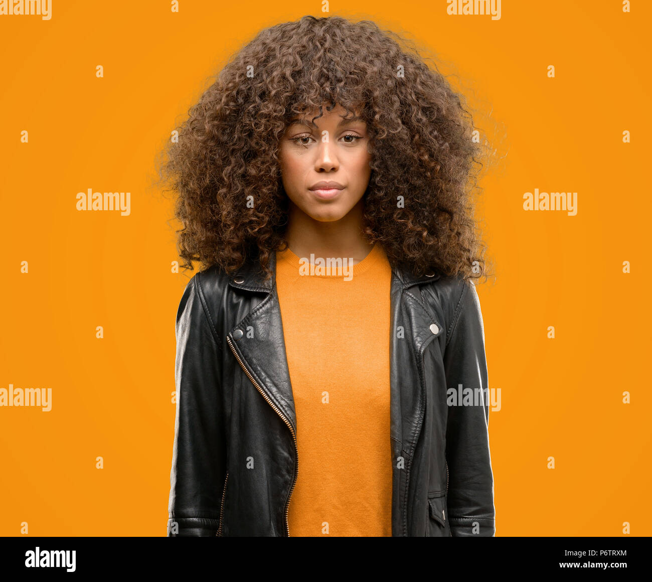 African american woman wearing a leather jacket with a confident ...
