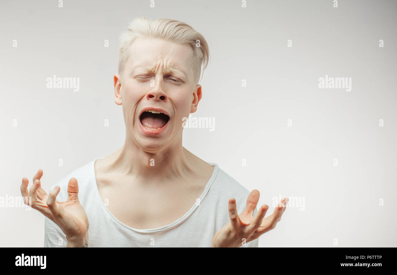 Dramatic emotional portrait of desperate enraged young man, screaming ...