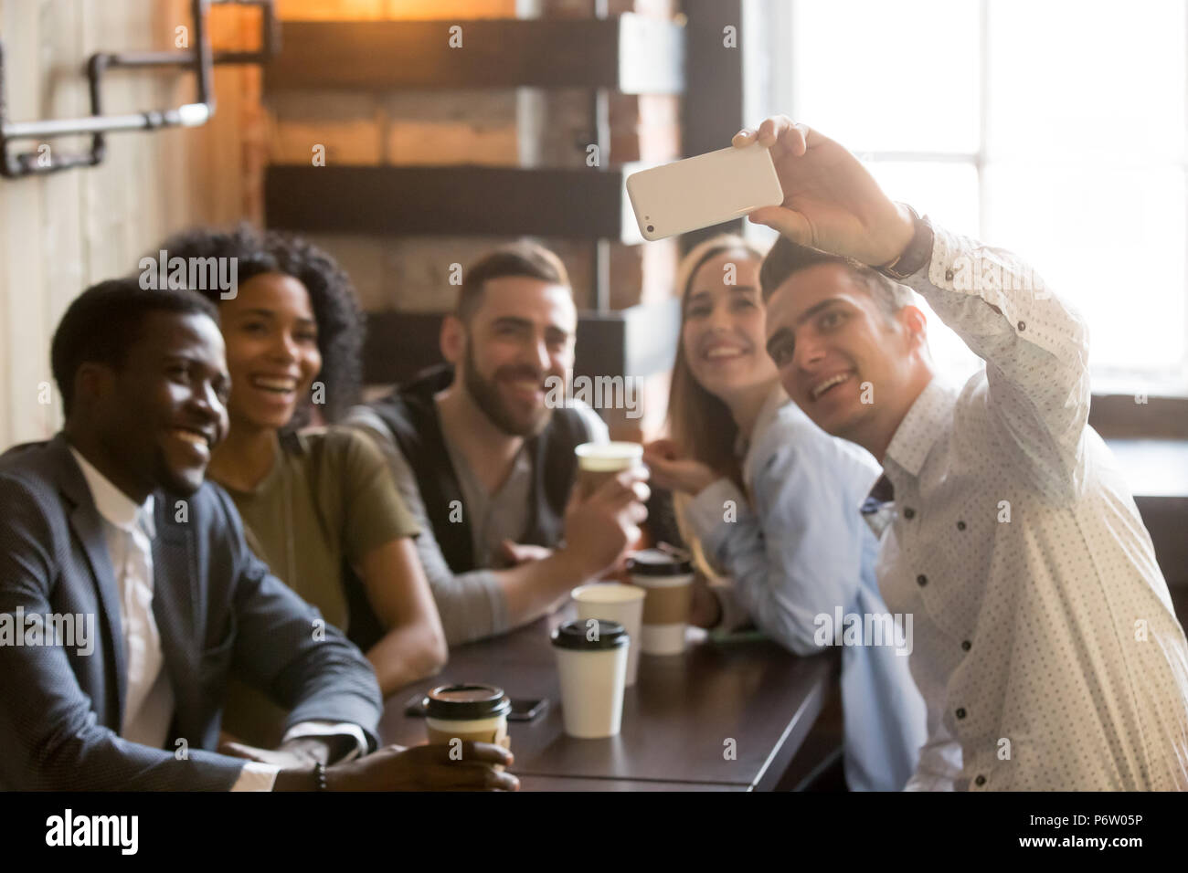 Millennial friends having fun making selfie in cafe Stock Photo - Alamy