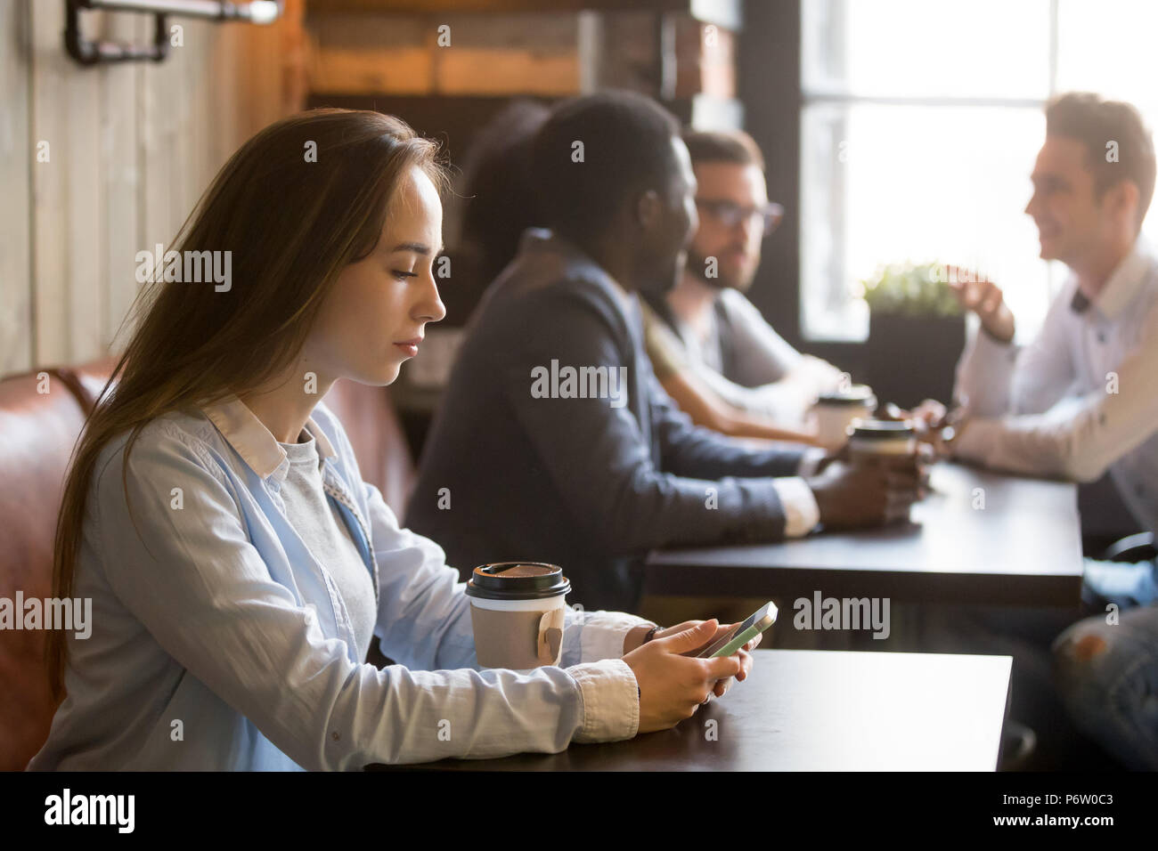 Woman alone reading sitting cafe table hi-res stock photography and ...
