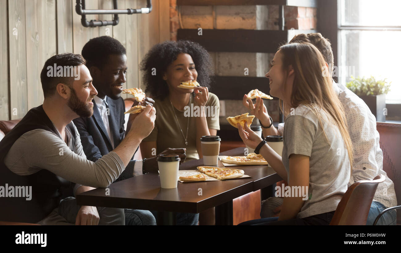 Smiling multiracial colleagues enjoying lunch spending work brea Stock ...
