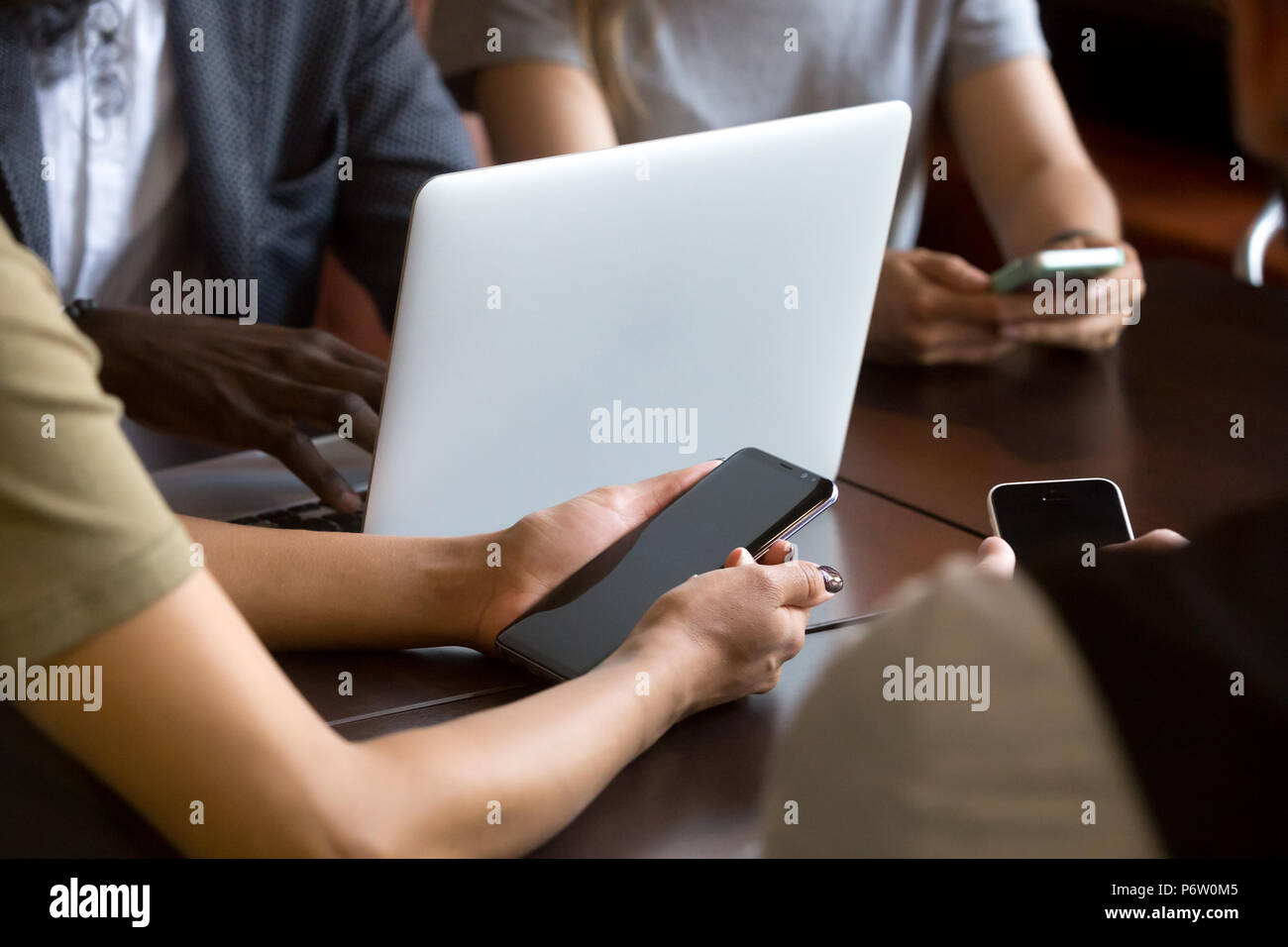 Close up of multiracial people using gadgets during meeting out Stock ...