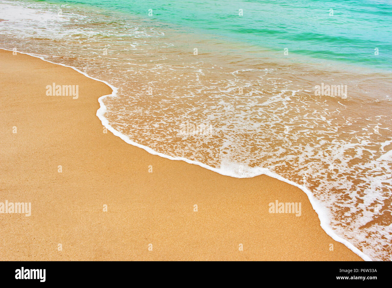 Wave of azure sea on sandy beach. Sea surface background Stock Photo - Alamy
