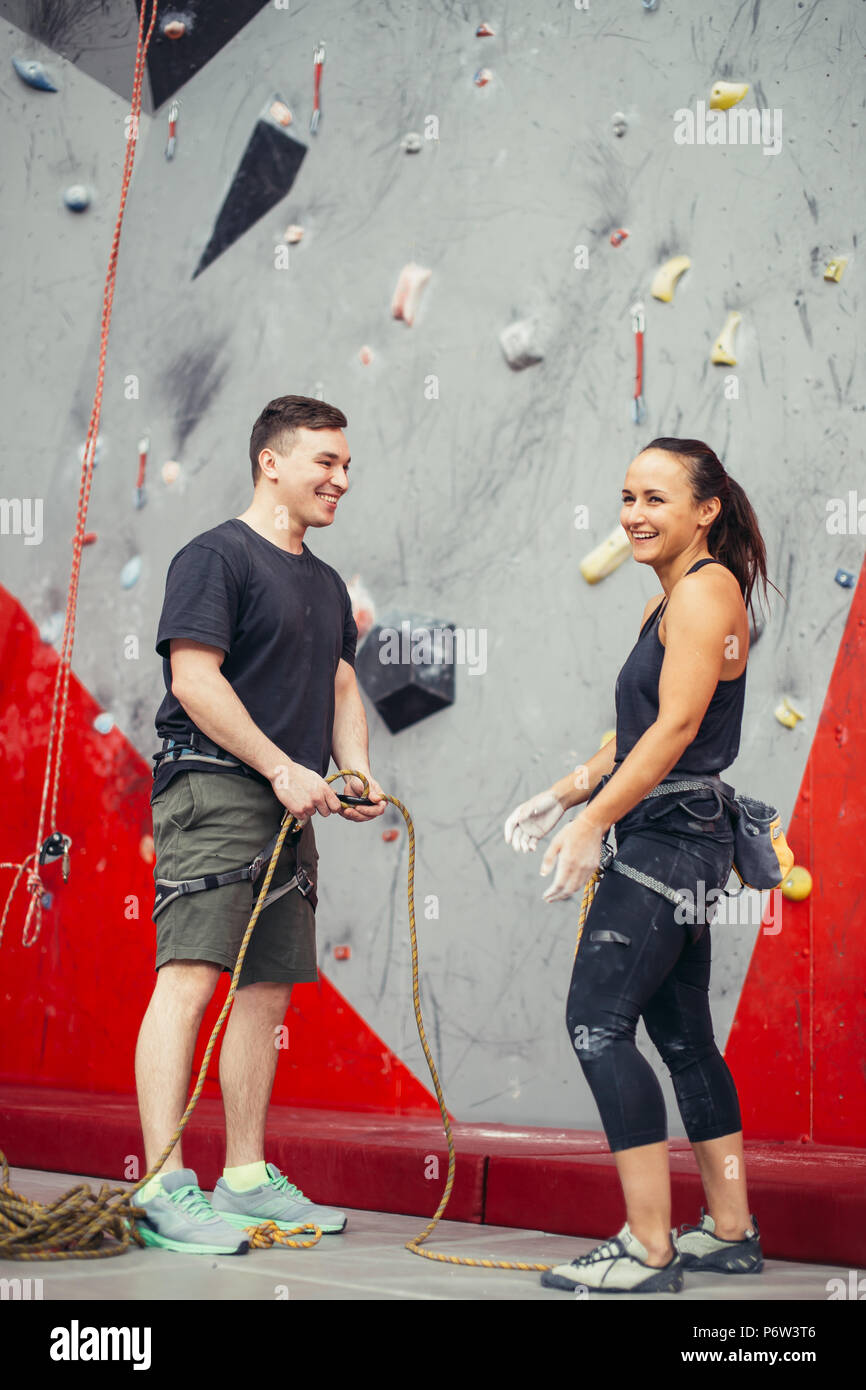 Rock climbing instructor is teaching how to tie the figure eight knot ...