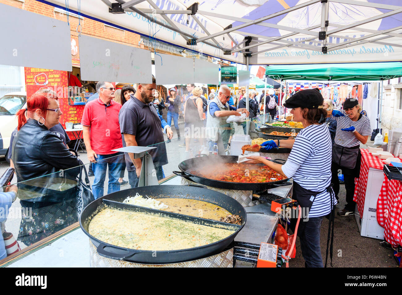 View along market stall selling hot food at Le Weekend French event ...