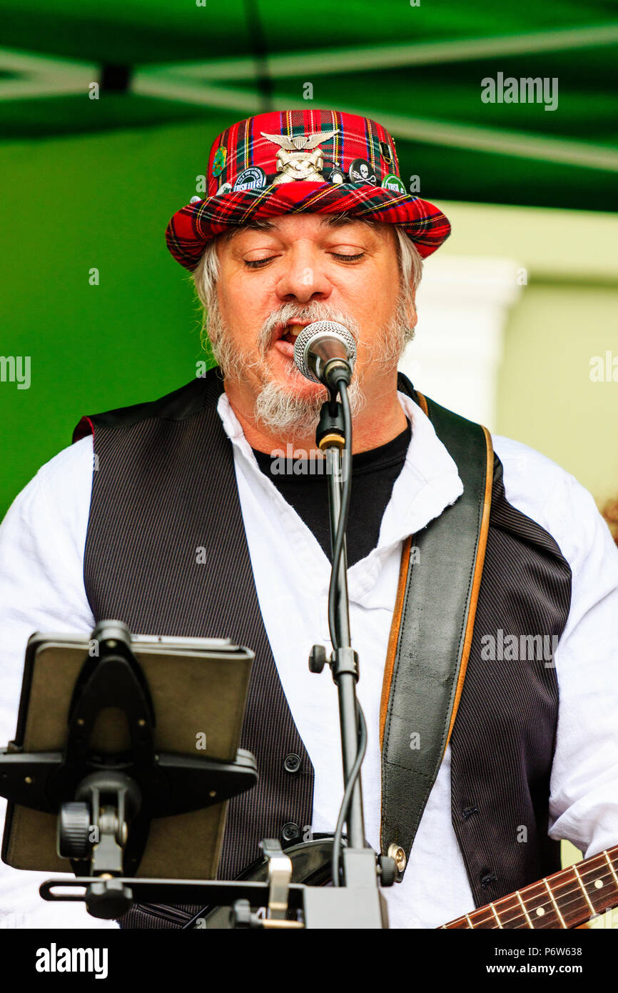 Close-up, waist up, Caucasian man, 40s, playing electric guitar at open ...
