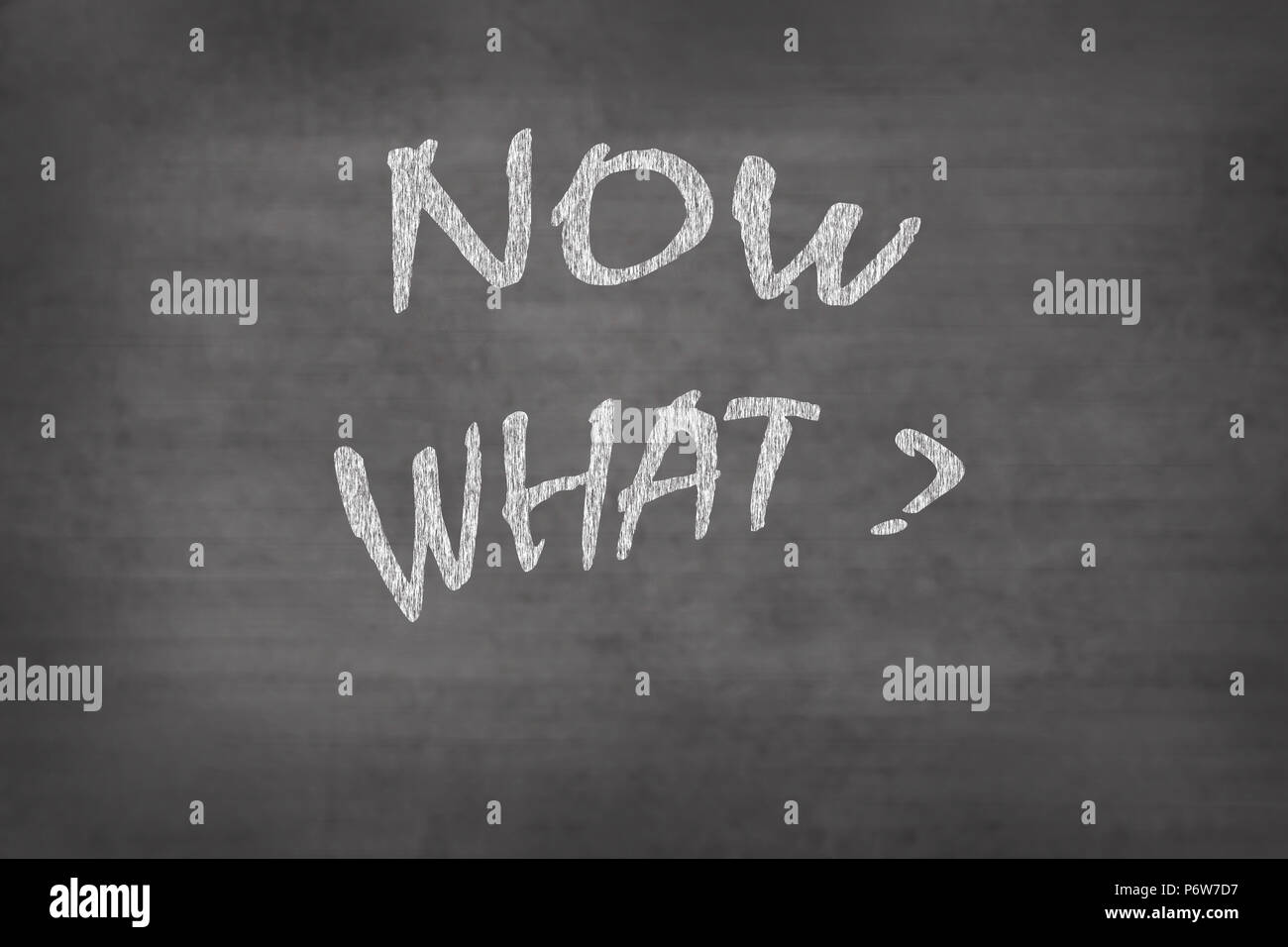 Now what sign on the school chalkboard Stock Photo - Alamy