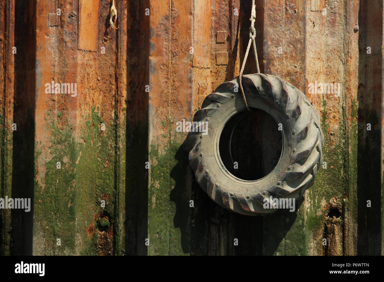 Coastal landscapes - Transport industry - rubber tyre suspended from ...