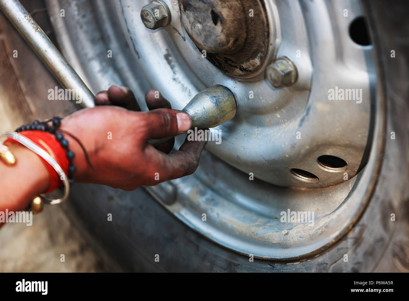 Replacing the wheels of the car on the road on their own Stock Photo ...