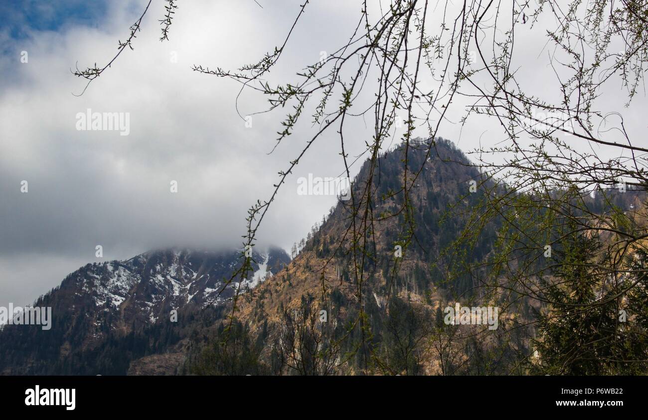 Snow disappearing in Austrian alps in the spring Stock Photo - Alamy