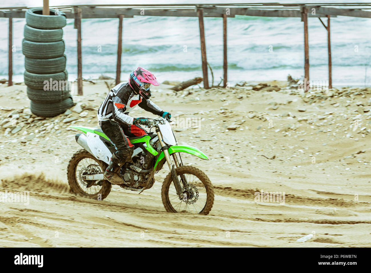 Close-up of accident in mountain bikes race in dirt track with flying ...