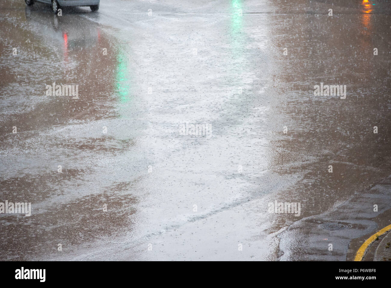 Puddle of rainwater on pavement hi-res stock photography and images - Alamy