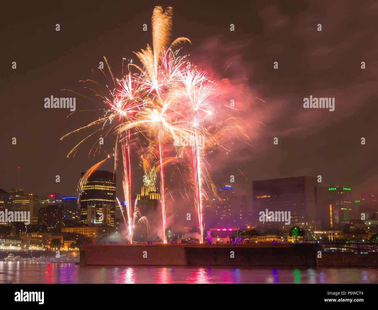Long exposure shot of colorful fireworks in the old port of Montreal ...