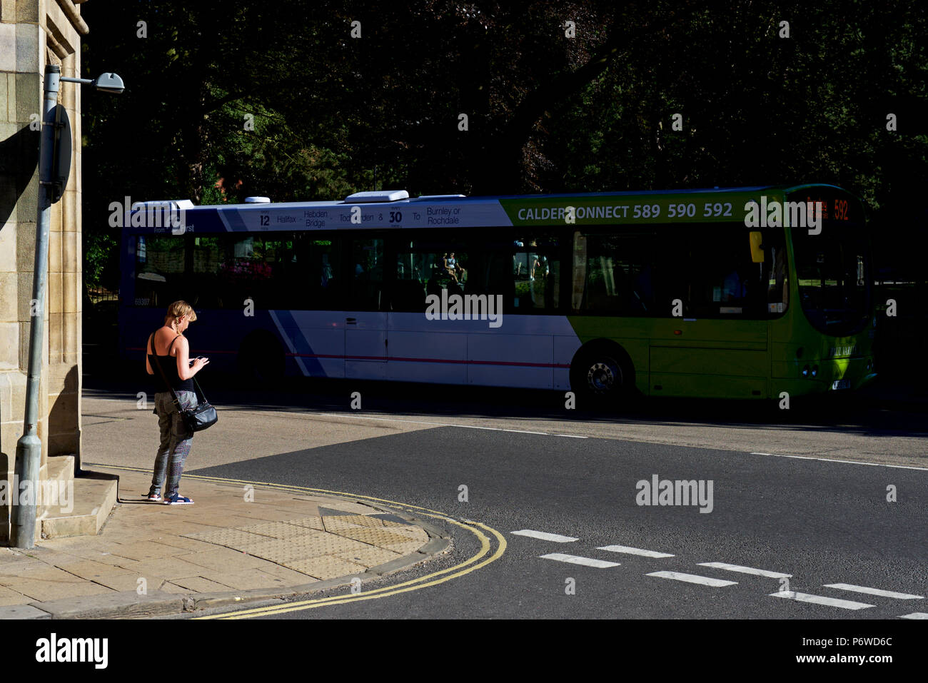Woman standing on pavement hi-res stock photography and images - Alamy