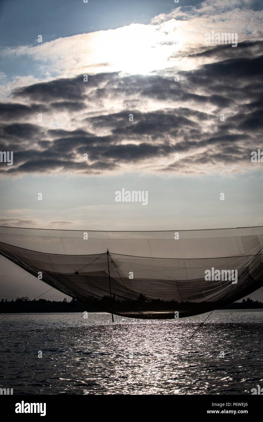 Vietnamese fishing net ready to drop to catch fish Stock Photo - Alamy