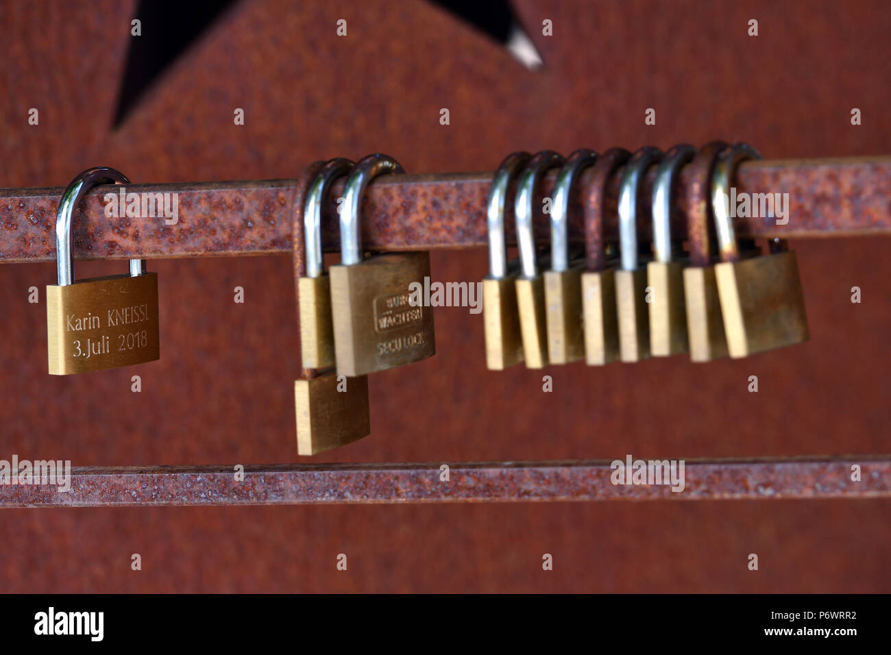 Schengen, Luxembourg. 03rd July, 2018. A personalised padlock (L) from ...