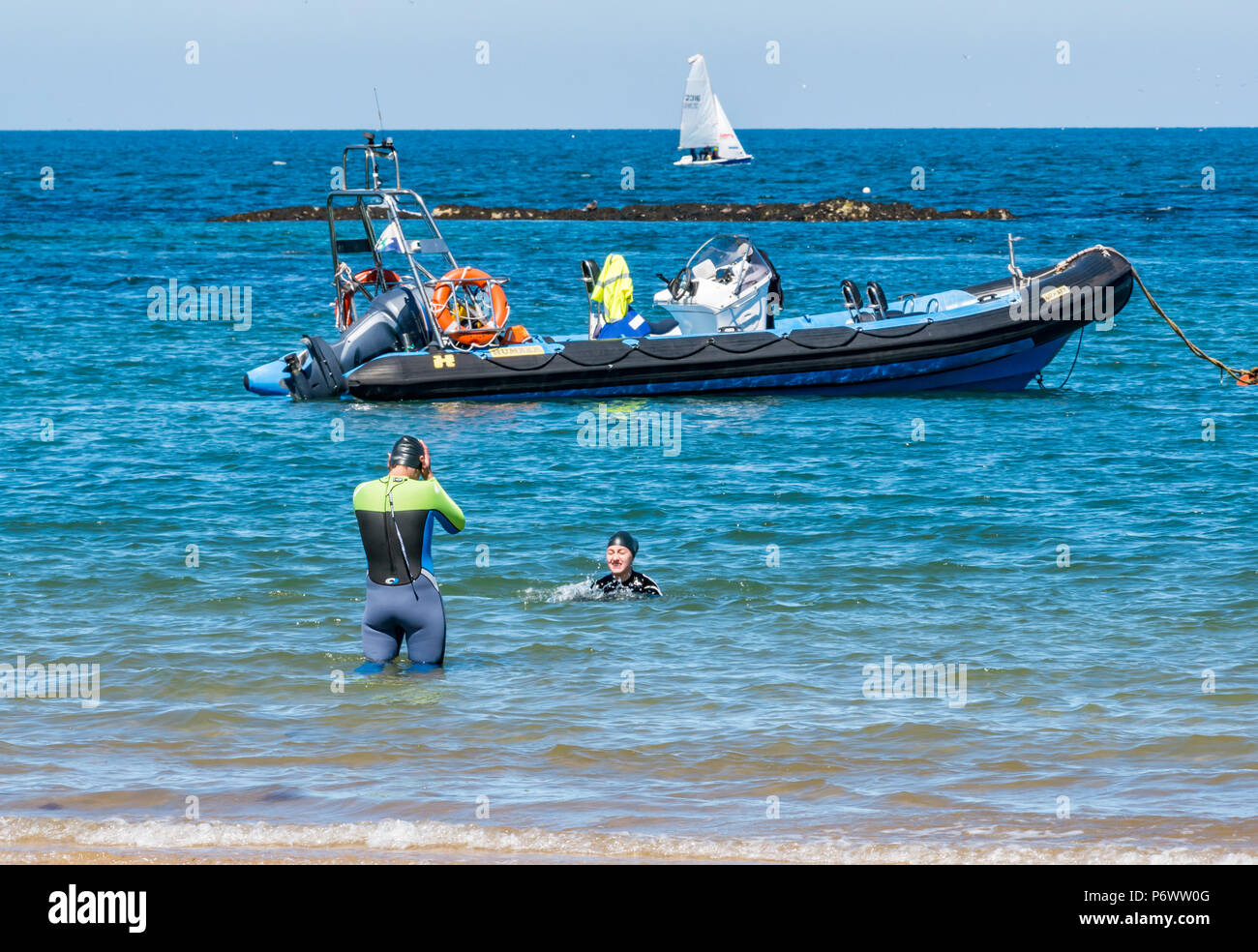 Woman wetsuit scotland hi-res stock photography and images - Alamy
