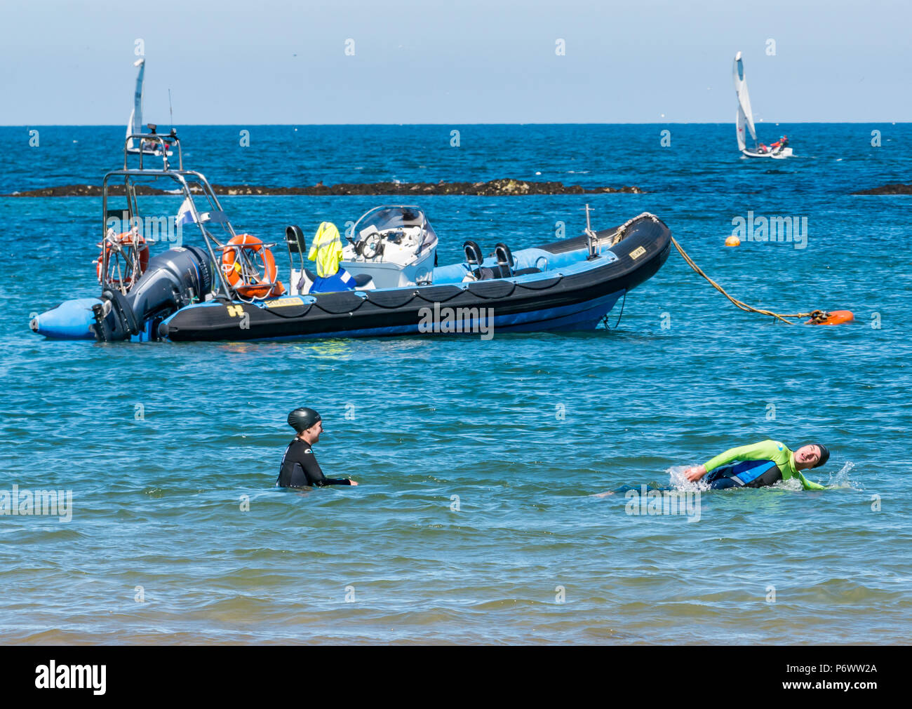 Woman wetsuit scotland hi-res stock photography and images - Alamy