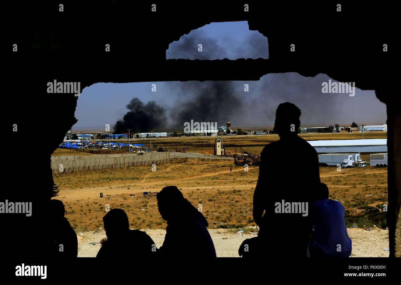 Amman, Jordan. 3rd July, 2018. Smoke rises from the Syrian side at the ...